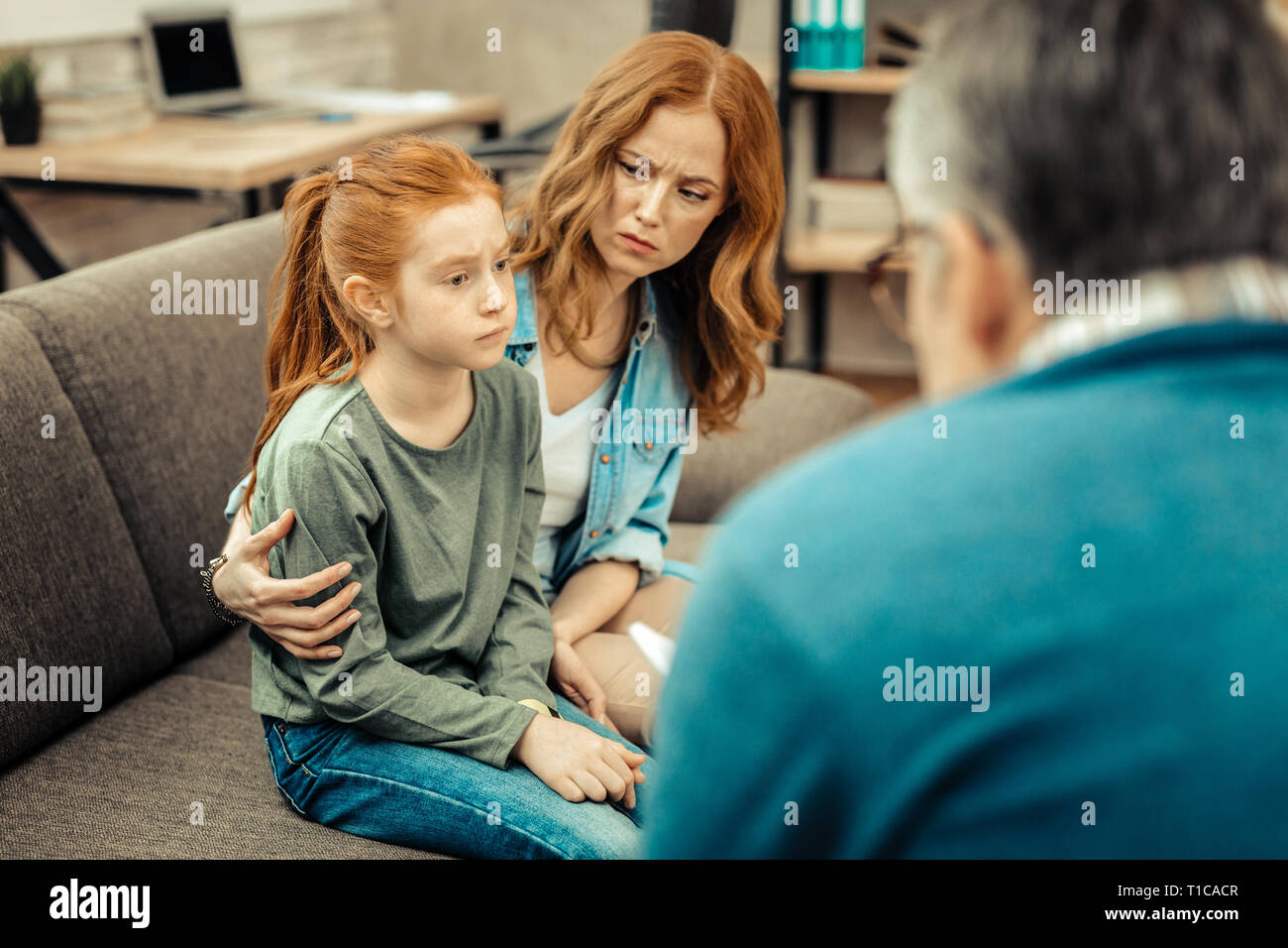 Sad nice young girl suffering from autism Stock Photo - Alamy