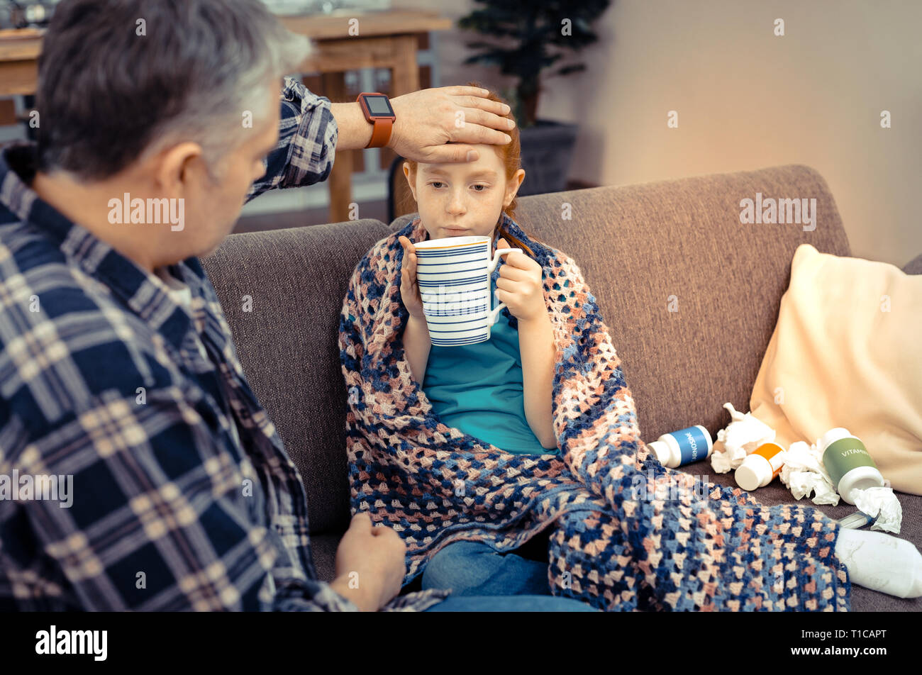 Sick girl drink hot tea hi-res stock photography and images - Alamy