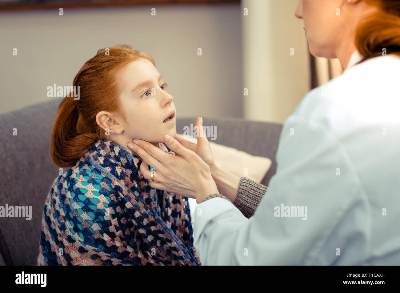 Nice cute girl having her health checked Stock Photo - Alamy