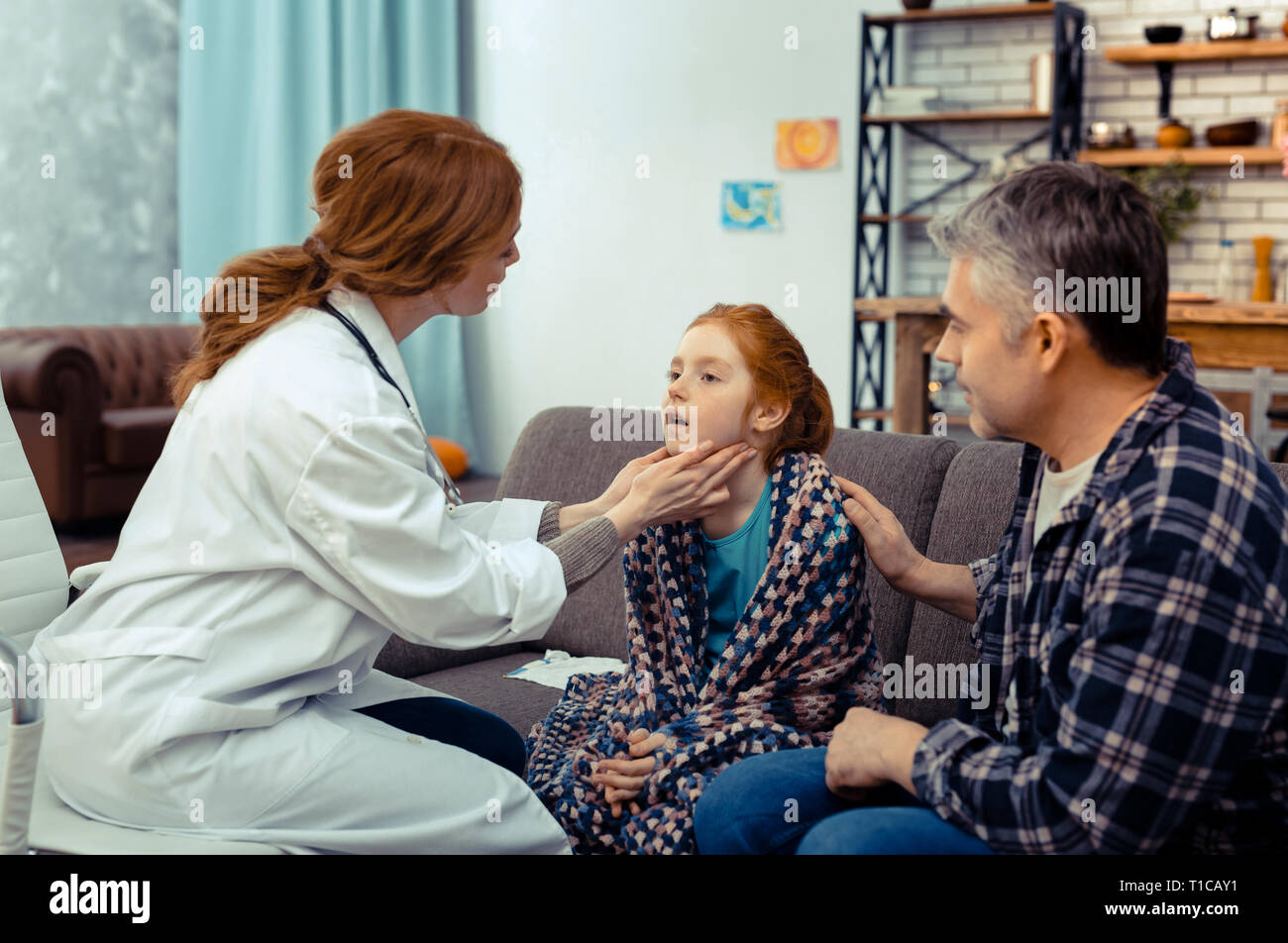 Child touching neck hi-res stock photography and images - Alamy