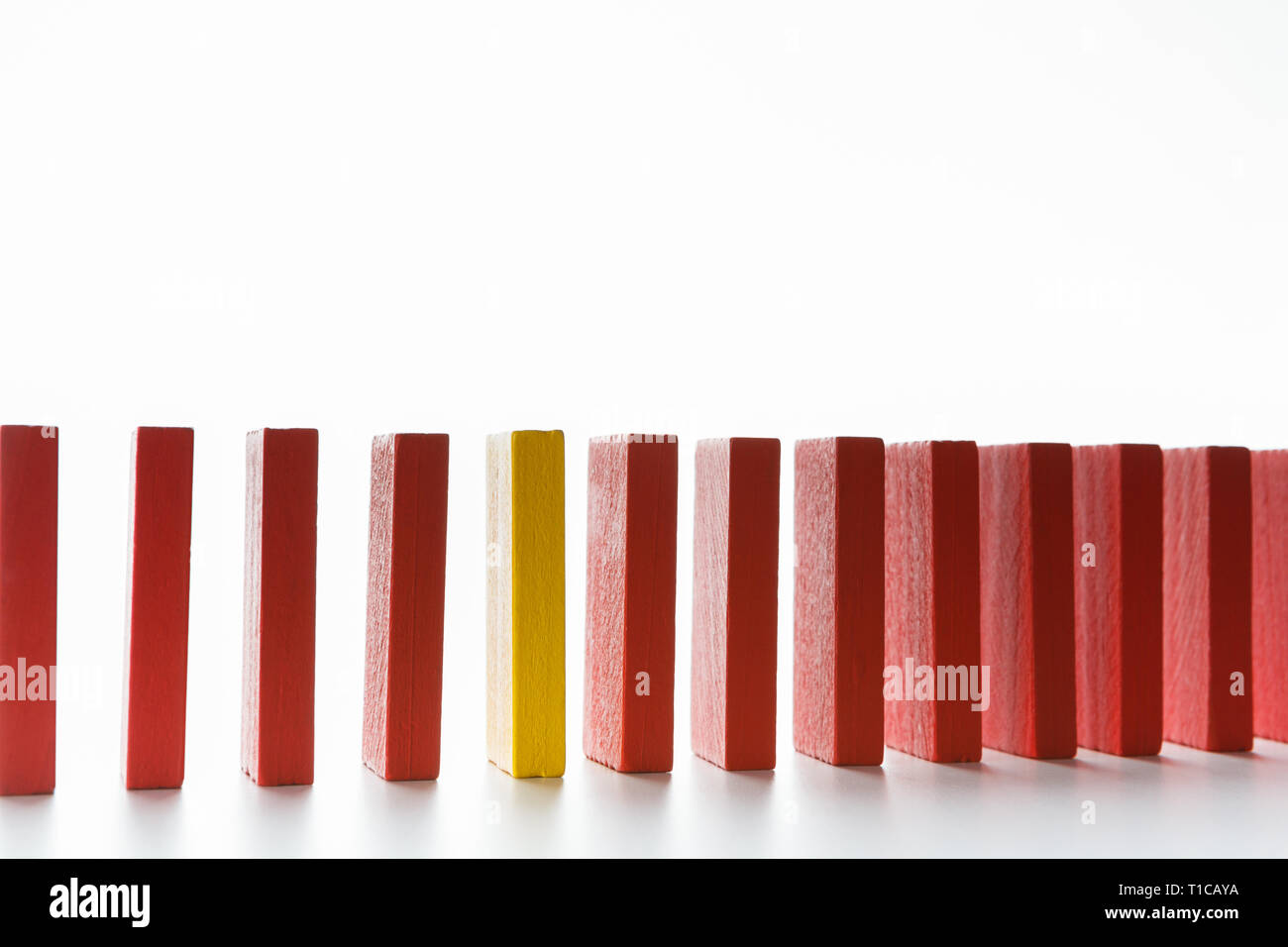 One red wooden block among yellow ones Stock Photo - Alamy