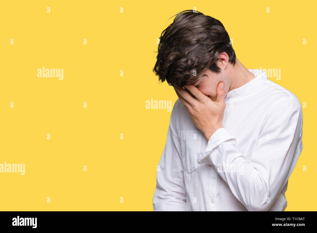 Young handsome business man over isolated background with sad ...