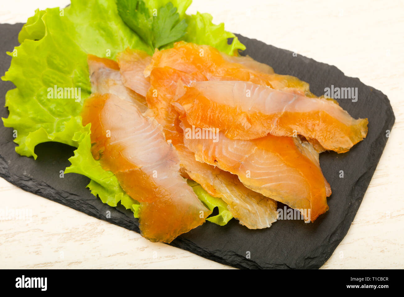 Smoked catfish fillet carpaccio Stock Photo - Alamy
