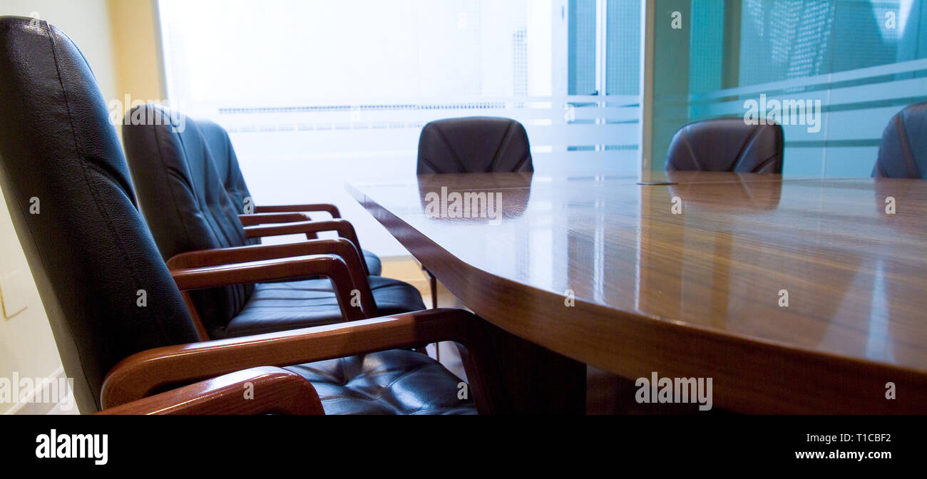 A big table of the empty meeting room Stock Photo - Alamy