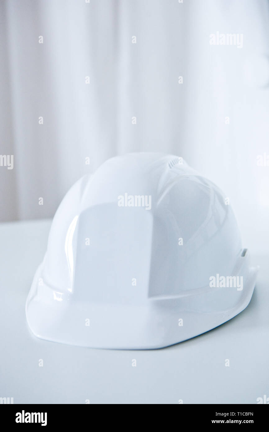 White security helmet on the white background Stock Photo - Alamy