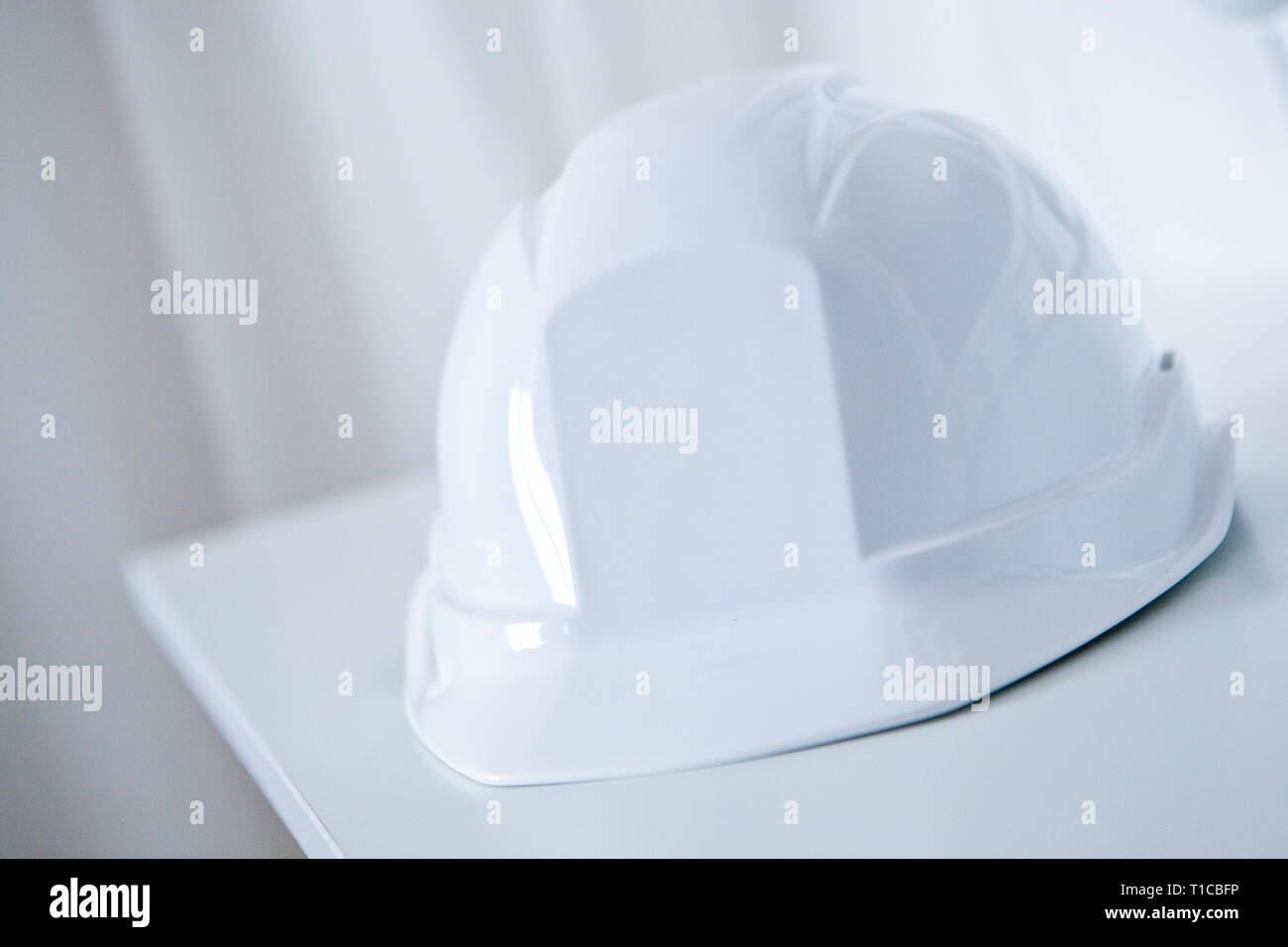White security helmet on the white background Stock Photo - Alamy