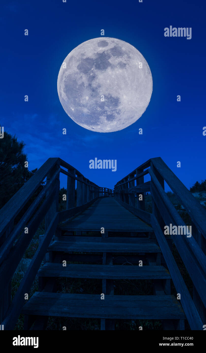Wooden footbridge at night with supermoon Stock Photo - Alamy