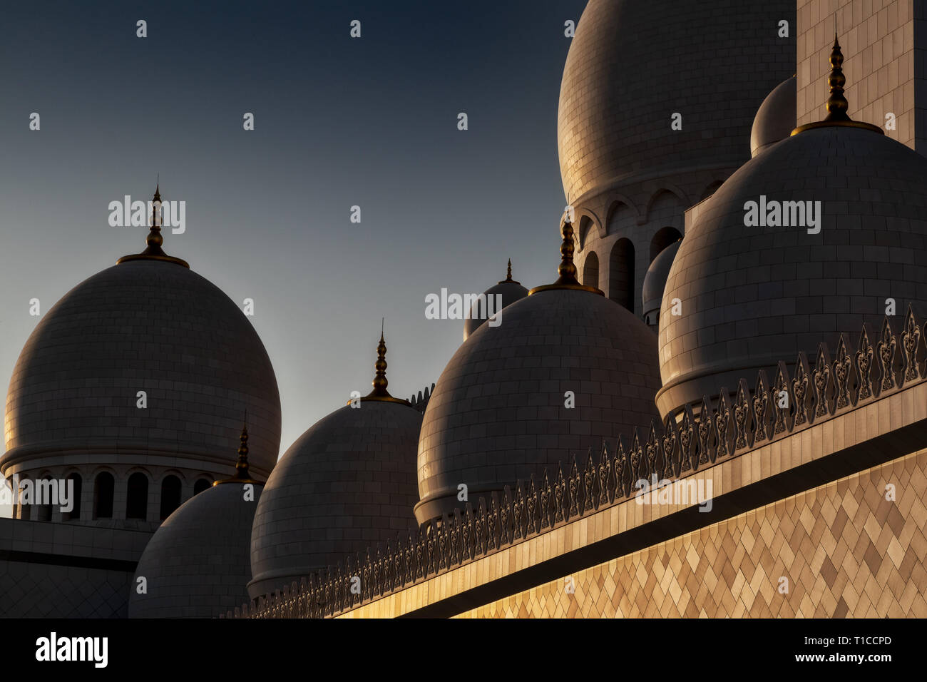 Cupolas in great mosque, abu dhabi, with sunset light Stock Photo - Alamy