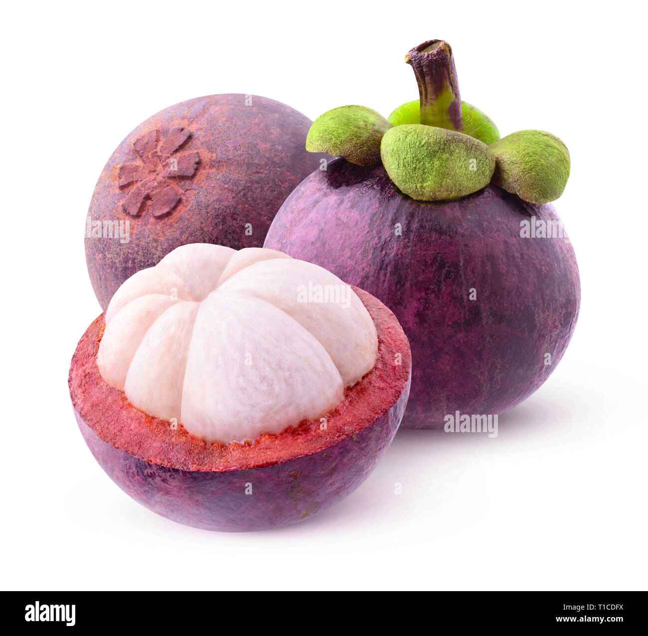 Isolated mangosteens. Two whole mangosteen fruit and a half isolated on ...