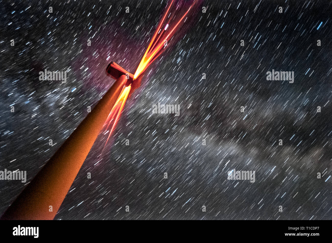 Windmills at night with the milky way in the background Stock Photo - Alamy