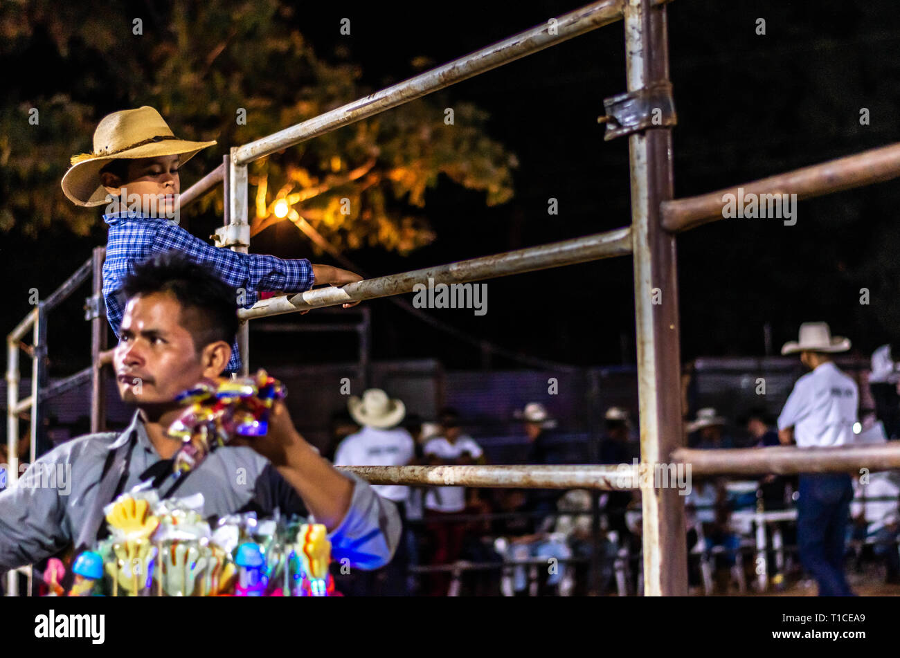 latin man selling candy in Guatemalan rodeo Stock Photo - Alamy