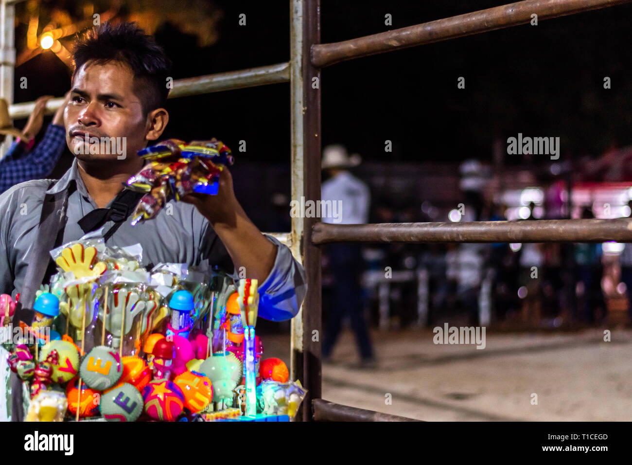 latin man selling candy in Guatemalan rodeo Stock Photo - Alamy