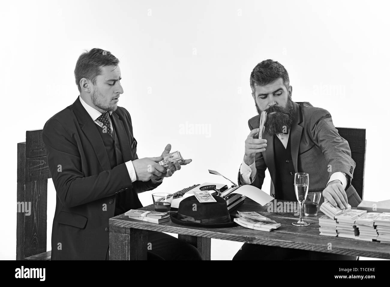 Money is money. Businessmen counting cash money. Busy men planning ...