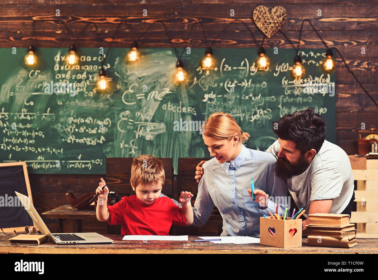 Genius baby enjoy dreawing with family. Genius son study painting with ...