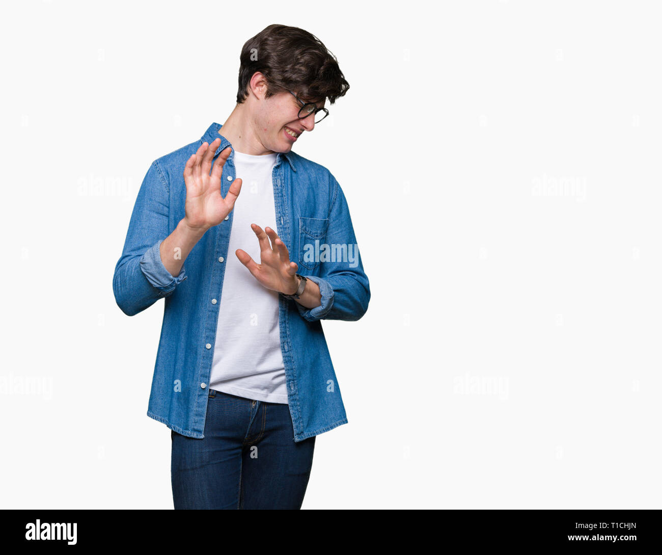 Young handsome man wearing glasses over isolated background disgusted ...