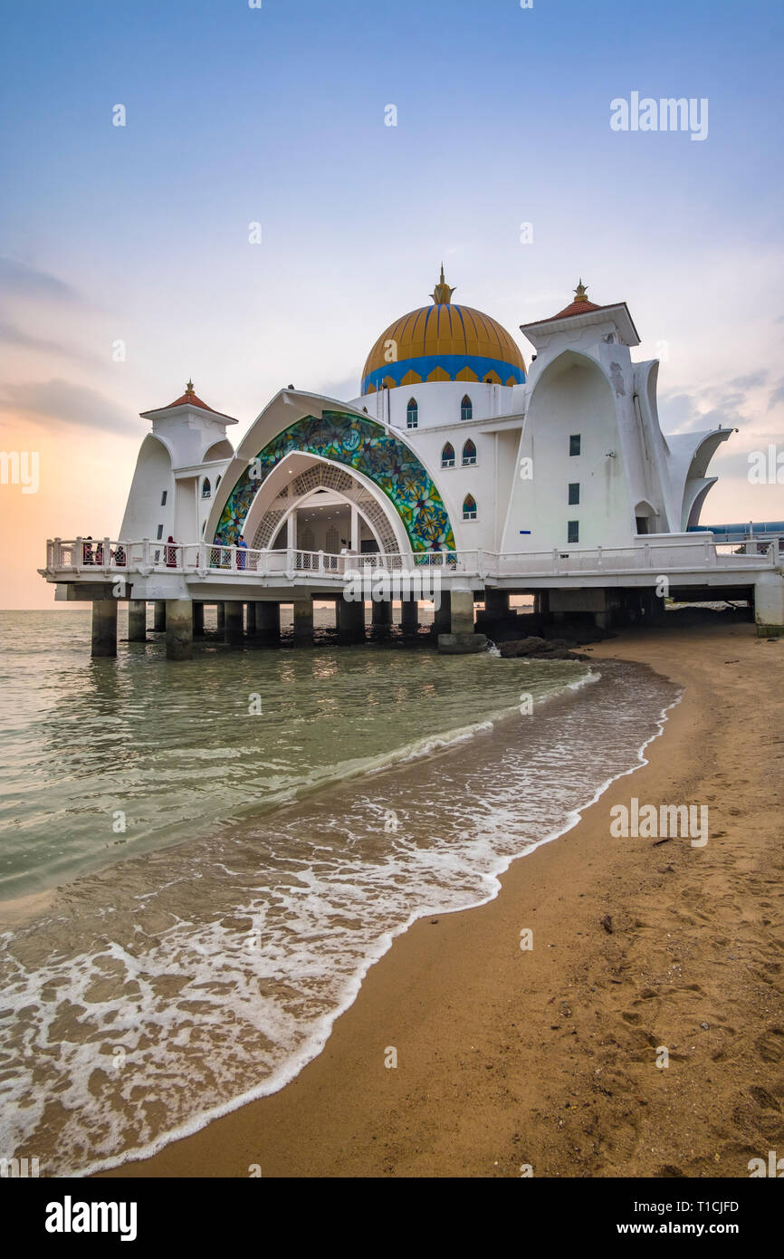 Sunset over Melaka Straits Mosque, located in Malaysia, and built using ...