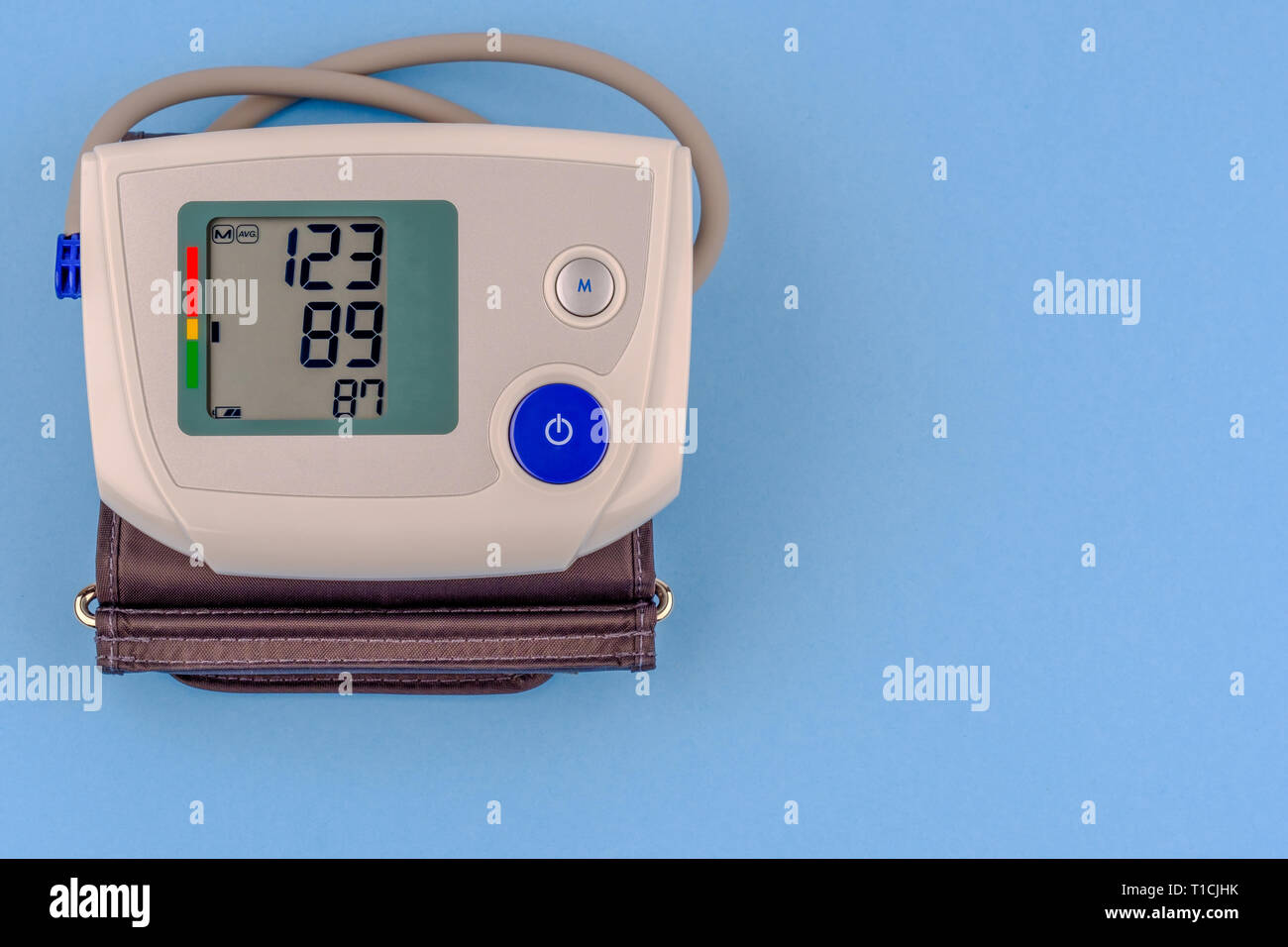 Modern electronic medical pressure monitor on a blue background Stock ...