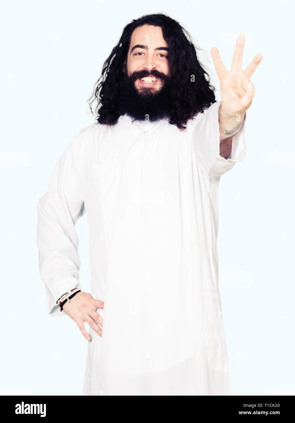 Man wearing Jesus Christ costume showing and pointing up with fingers ...