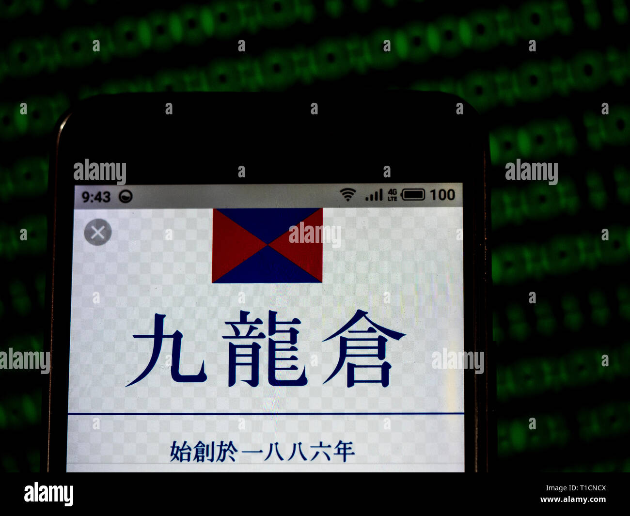 In this photo illustration a Wheelock & Co logo seen displayed on a ...