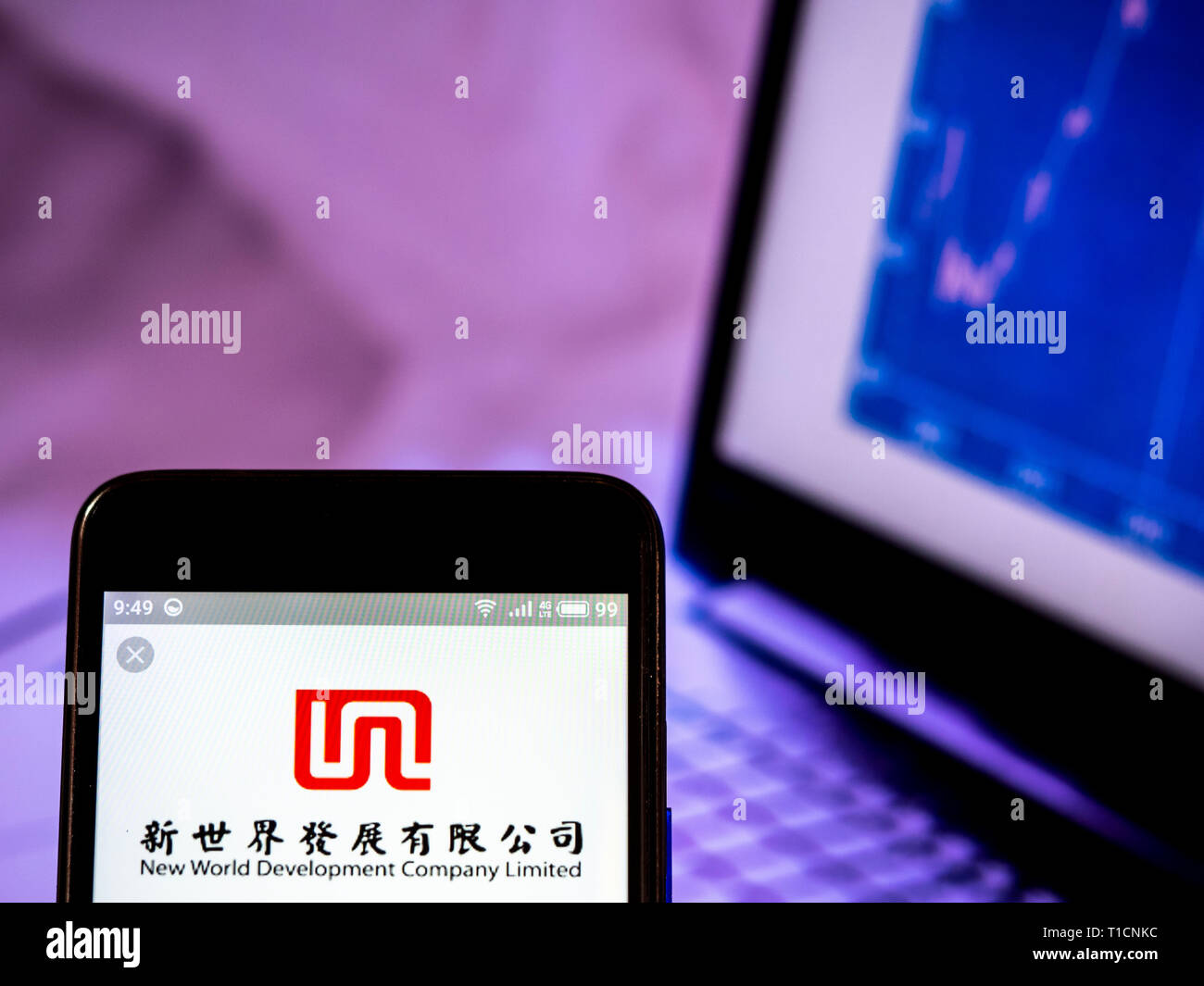 In this photo illustration a New World Development logo seen displayed ...