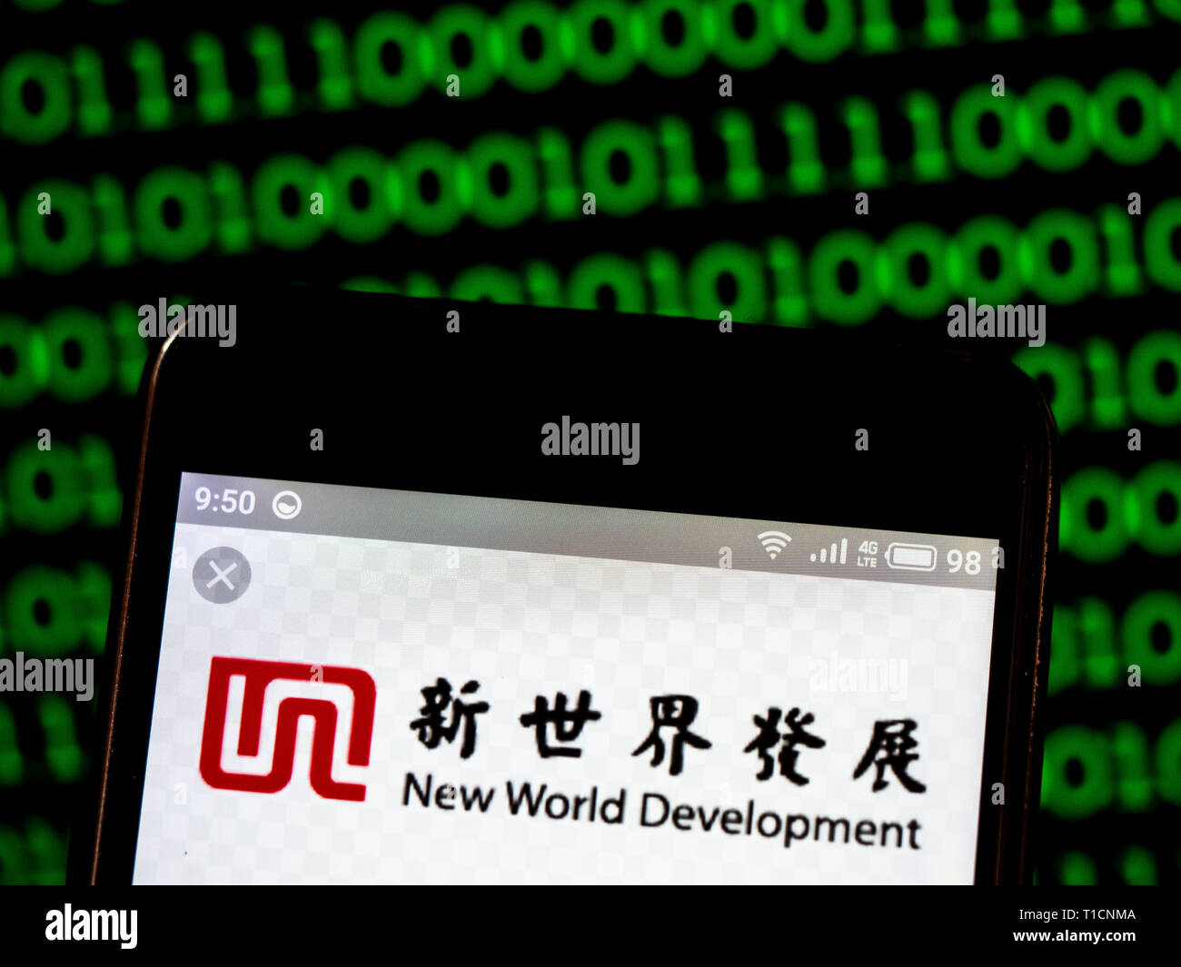 In this photo illustration a New World Development logo seen displayed ...