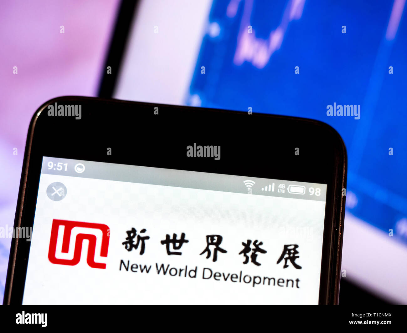 In this photo illustration a New World Development logo seen displayed ...