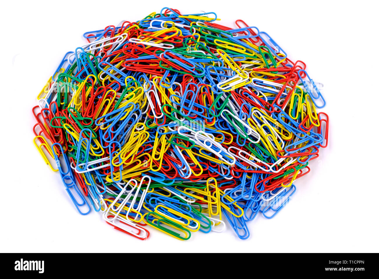 Pile of colored paper clips on isolated white background. Close up view ...