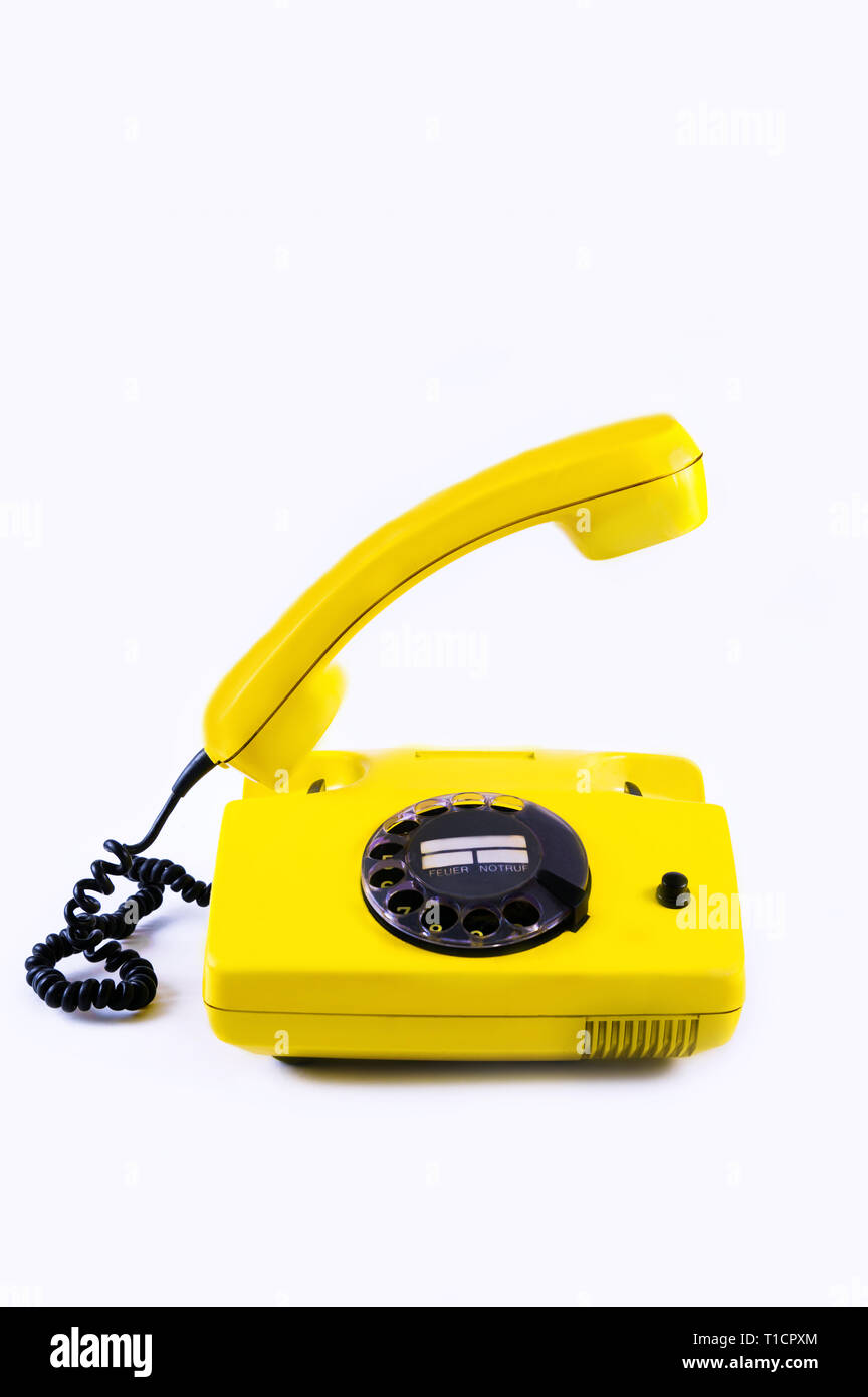 Yellow vintage phone on white background. Retro telephone with raised ...