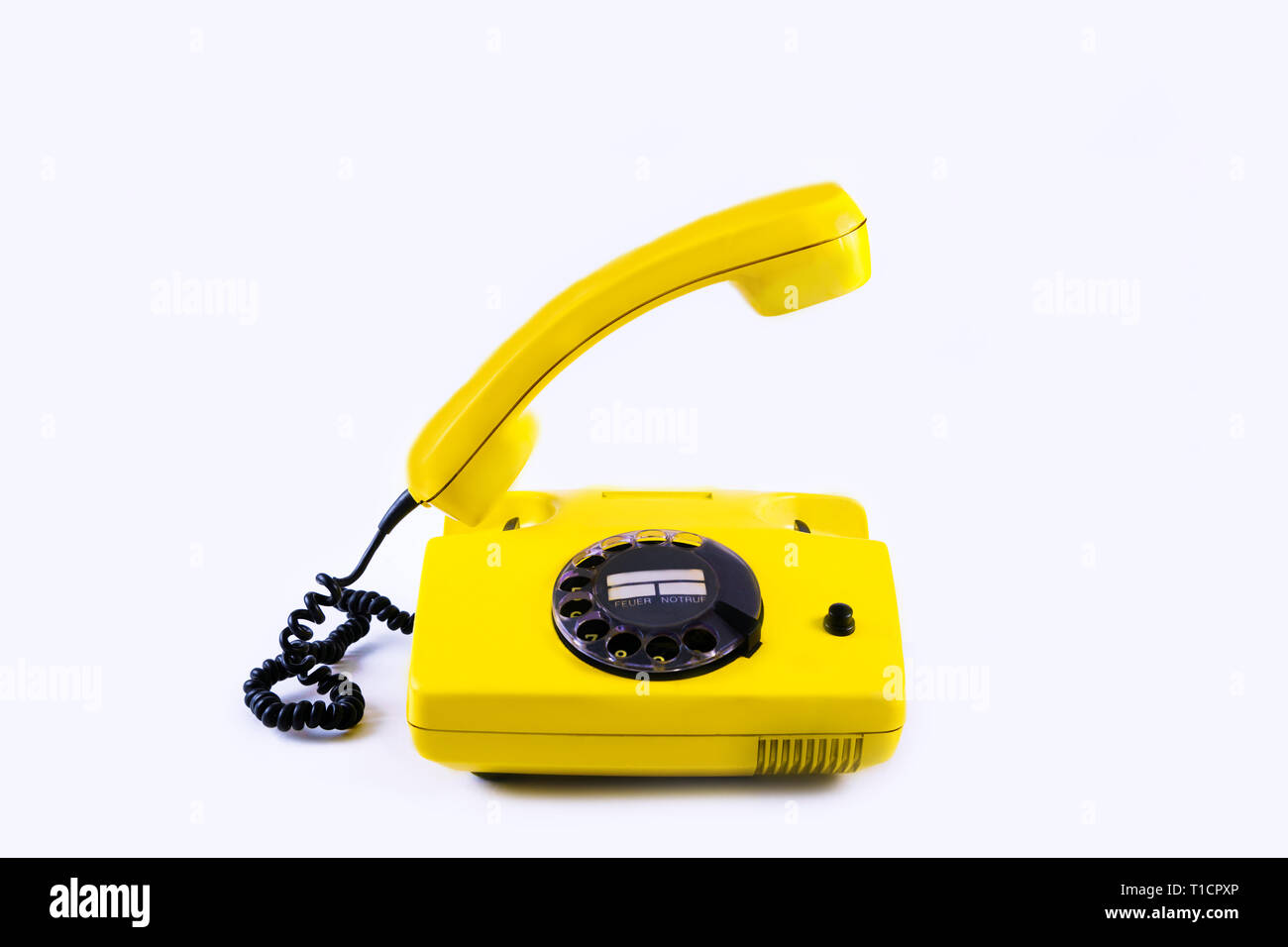 Yellow vintage phone on white background. Retro telephone with raised ...