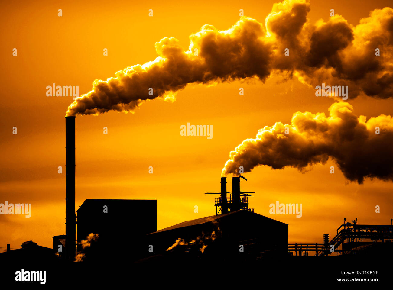 Pollution and smoke from chimneys of factory or power plant Stock Photo ...