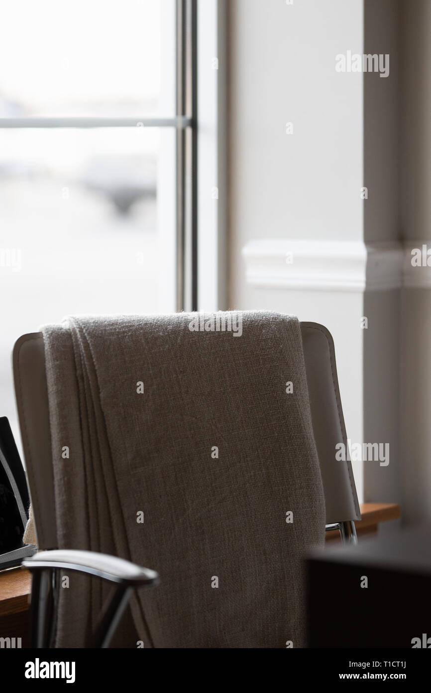 Cozy office chair in front of a bright window Stock Photo - Alamy