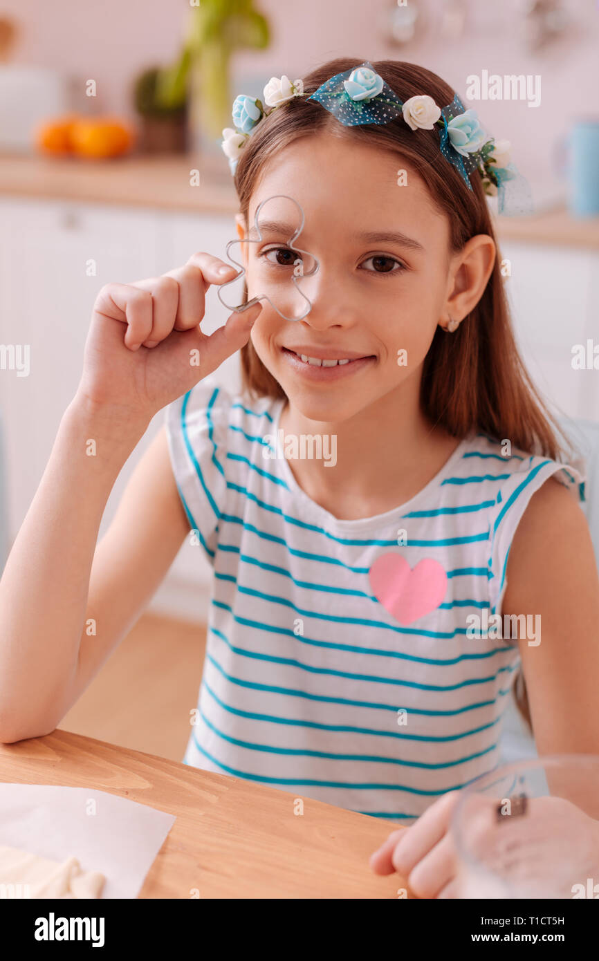 Positive delighted child demonstrating figure of the man Stock Photo ...