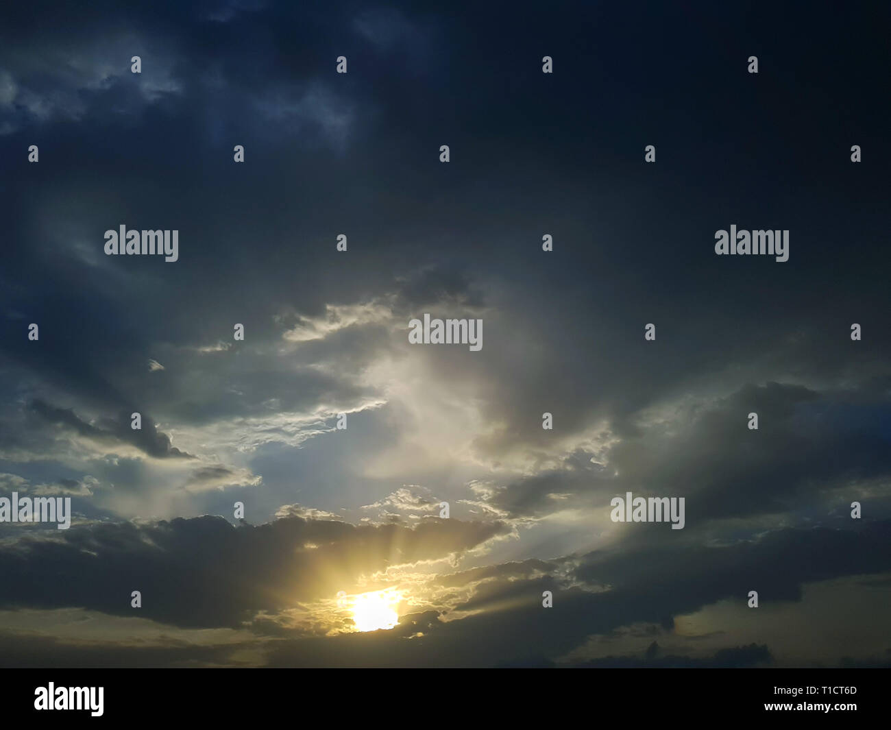 Sun shining through clouds hi-res stock photography and images - Alamy