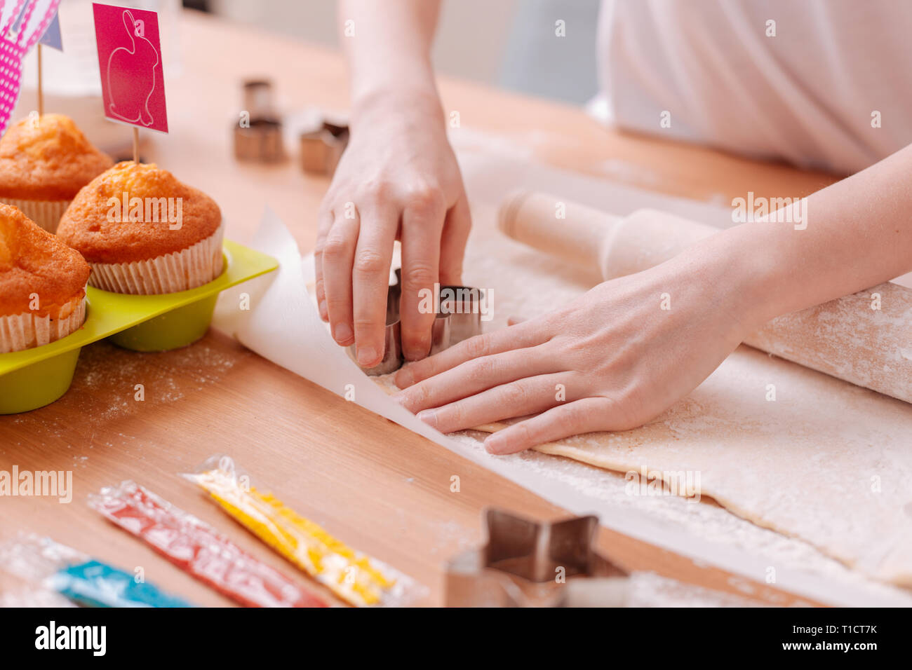 Focused photo on female hands that doing biscuits Stock Photo - Alamy