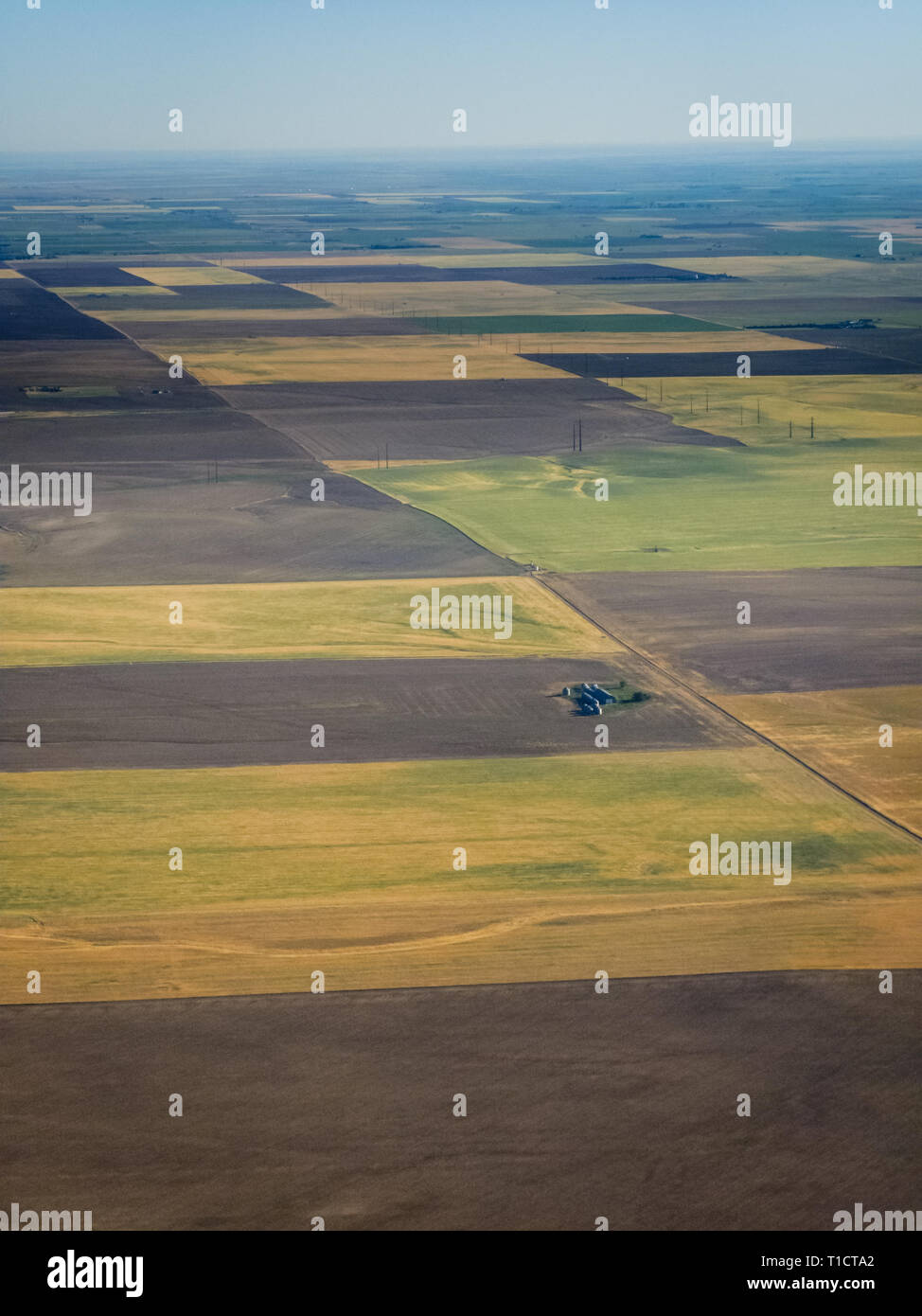 Aerial view of the pattern of cultivated crop fields in flat lands ...