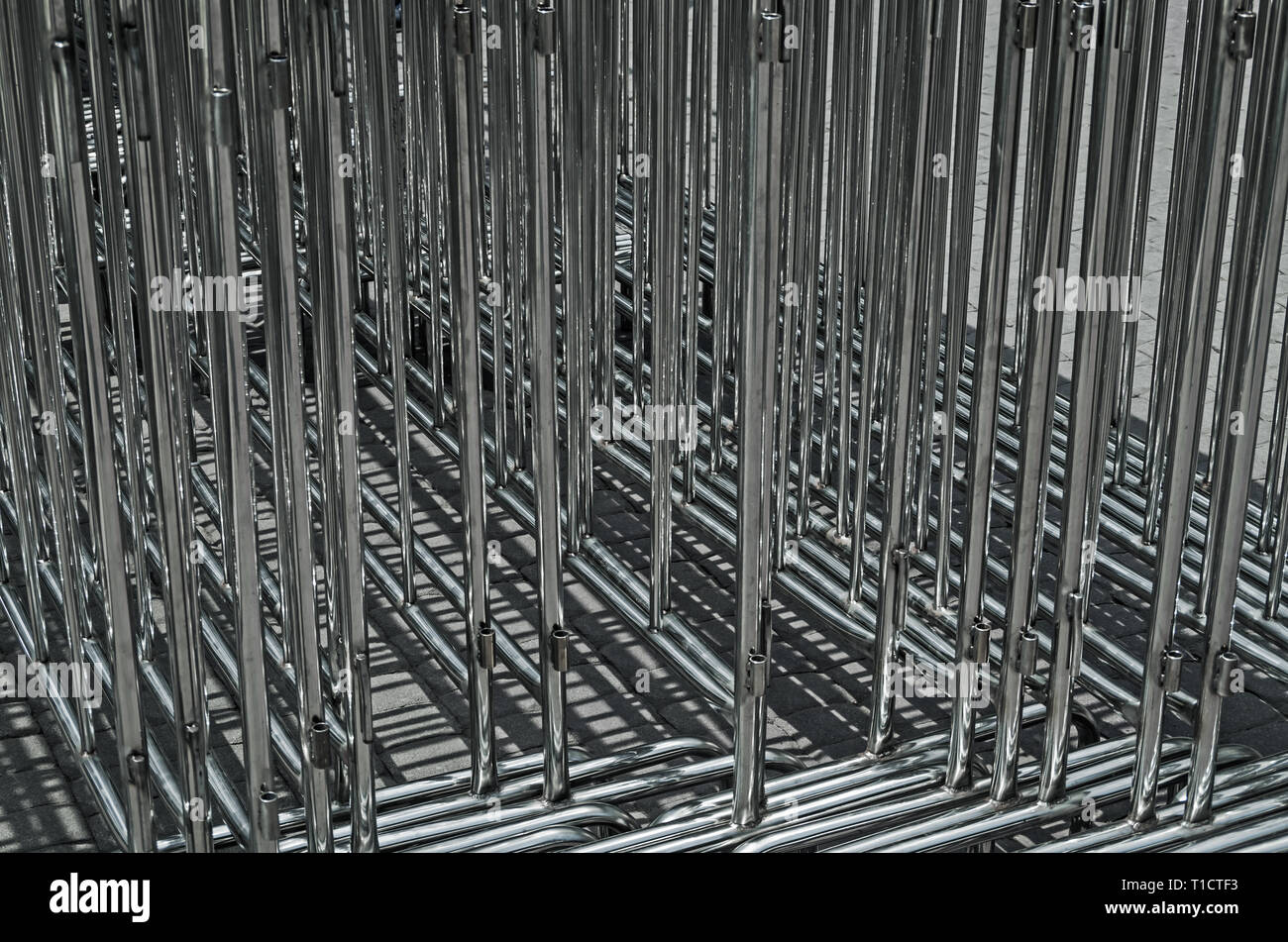 Portable sections of temporary fencing made of stainless steel are ...