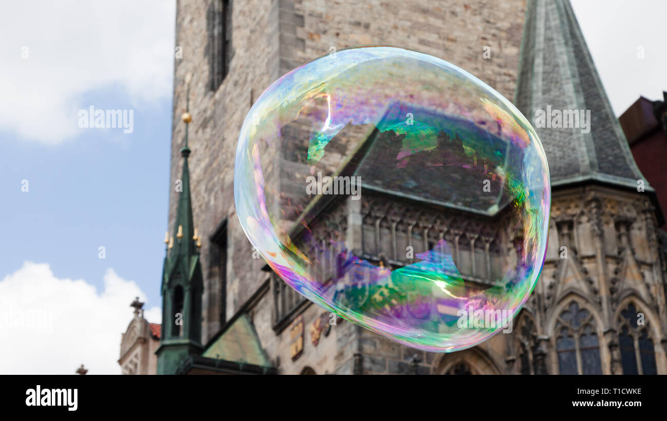 Prague old town square in a huge soap bubble Stock Photo - Alamy