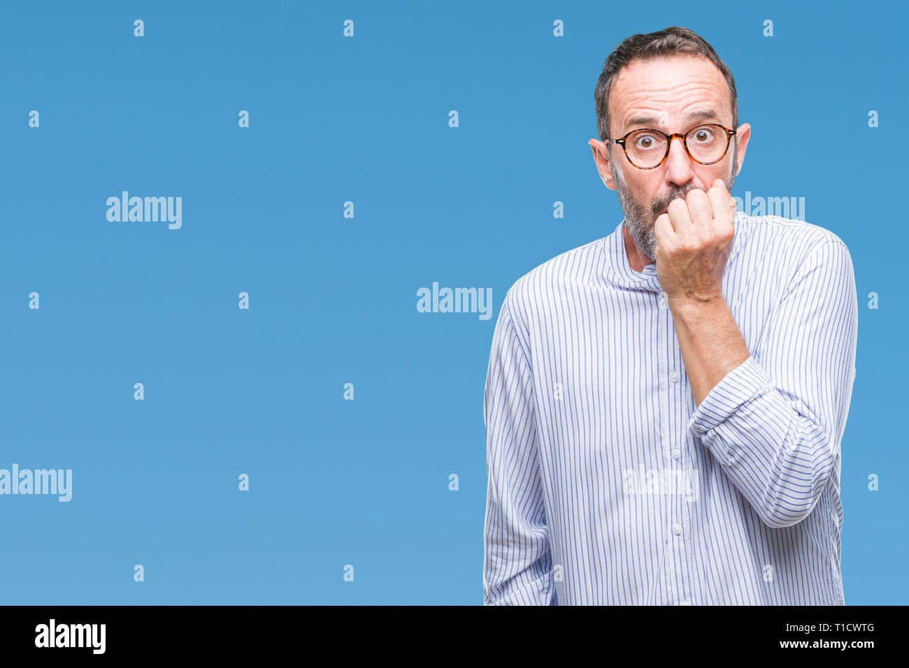 Middle age hoary senior man wearing glasses over isolated background ...