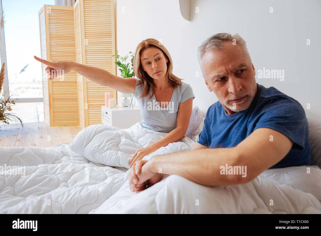 Husband not listening to his categorical emotional wife Stock Photo - Alamy