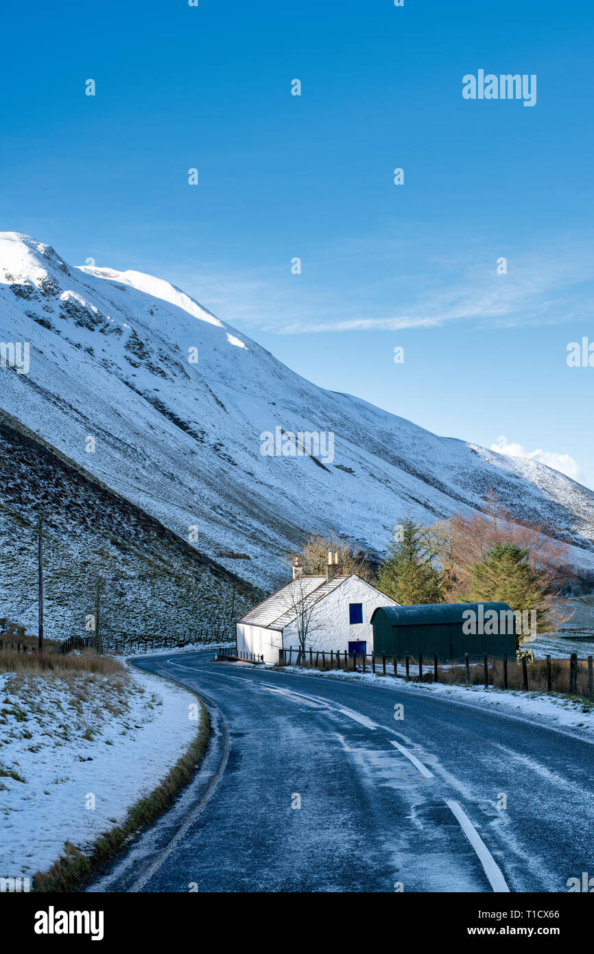 Scottish house in the snow along the Dalveen Pass in the Lowther Hills ...