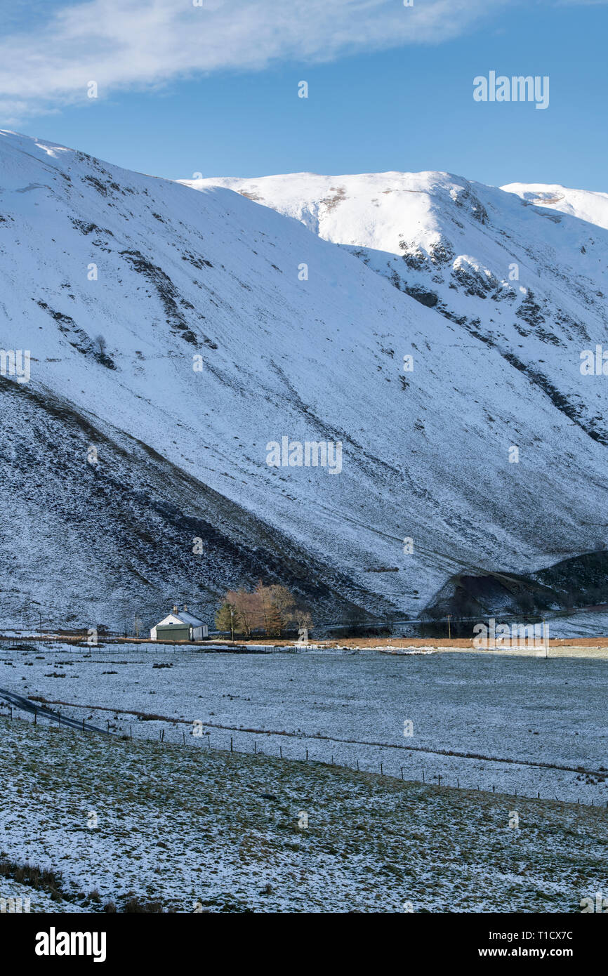 Scottish house in the snow along the Dalveen Pass in the Lowther Hills ...