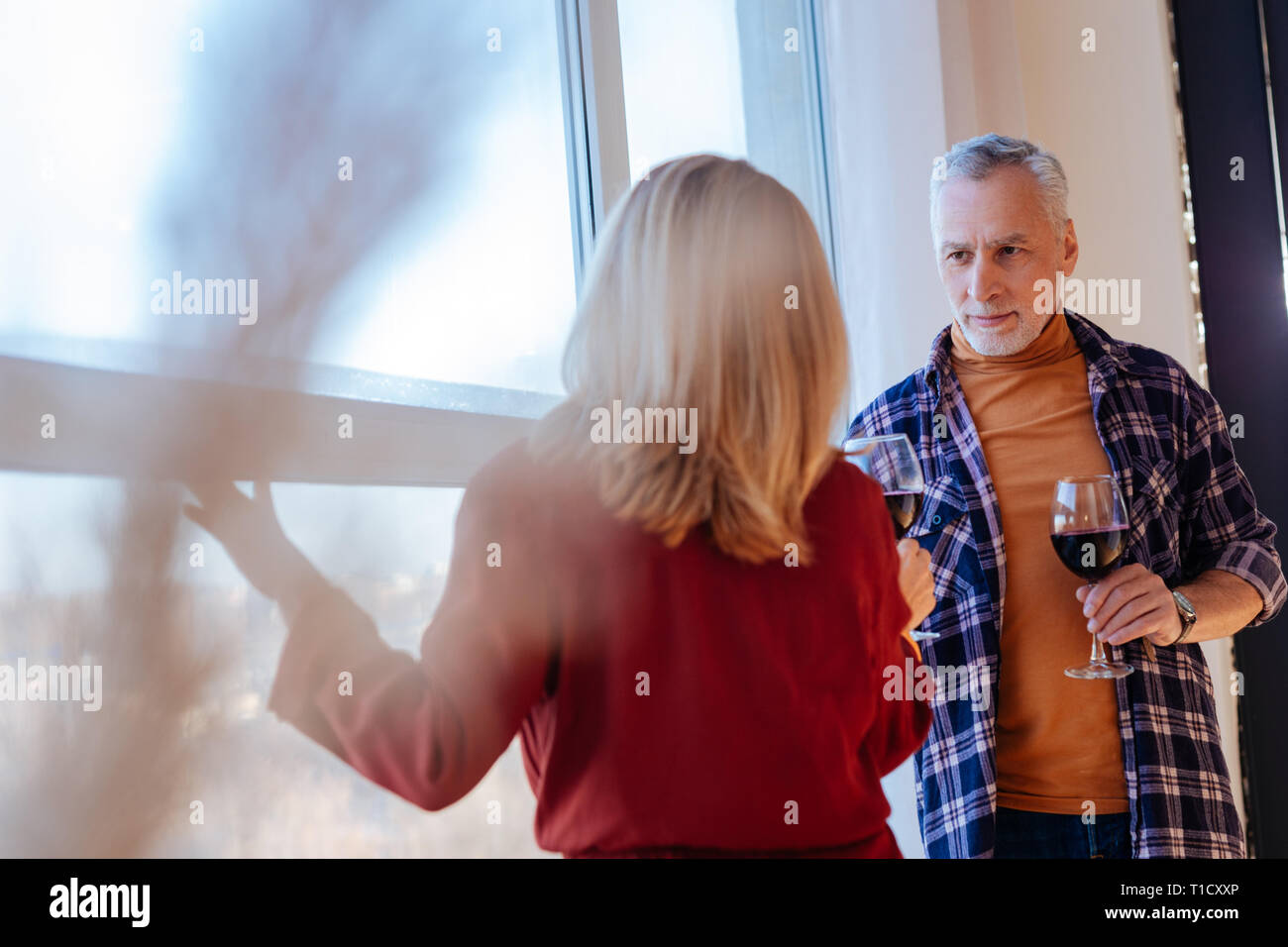 Businessmen standing near window at home and drinking red wine Stock ...