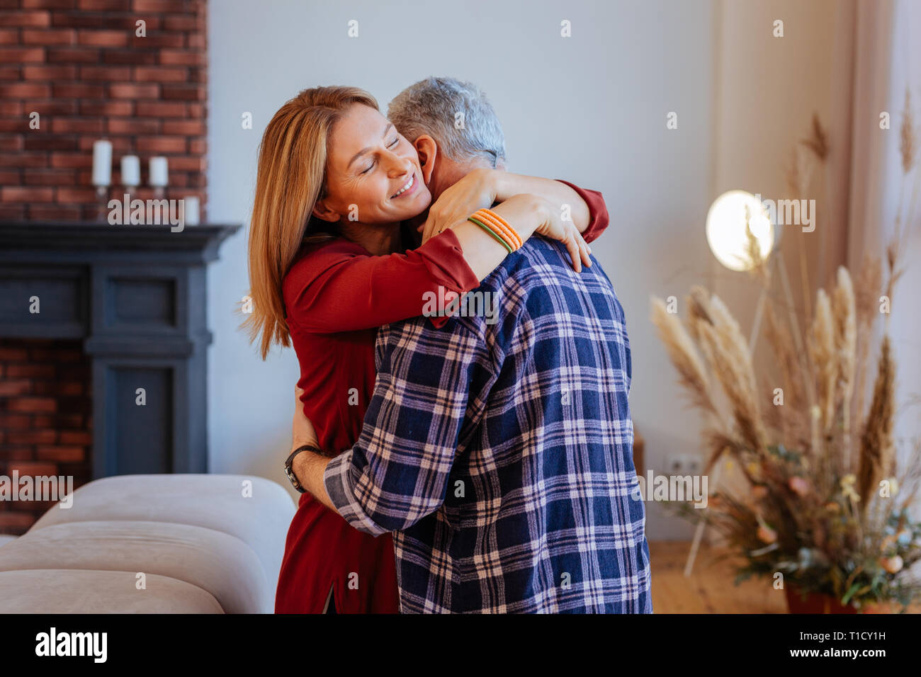 Thankful beaming wife hugging her supportive loving husband Stock Photo ...