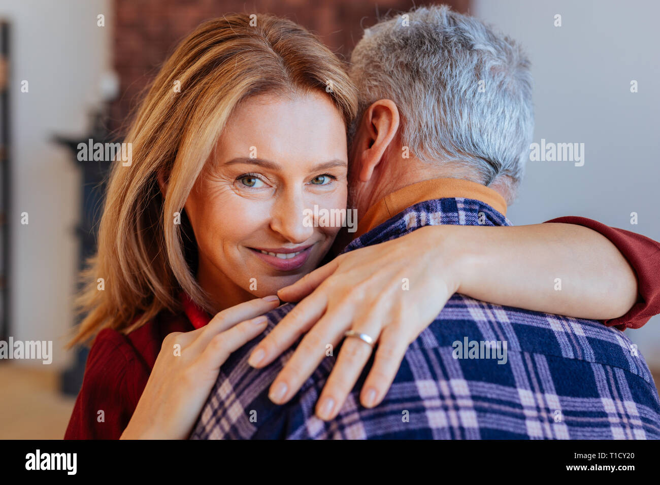 Beautiful green-eyed woman hugging her supportive man Stock Photo - Alamy