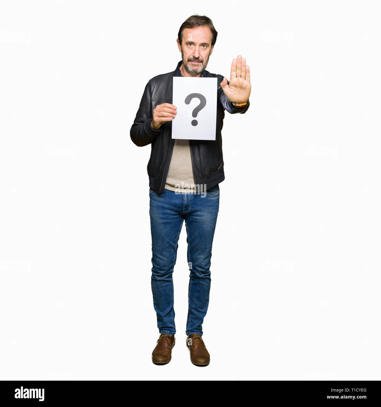Handsome middle age man holding paper with question mark with open hand ...