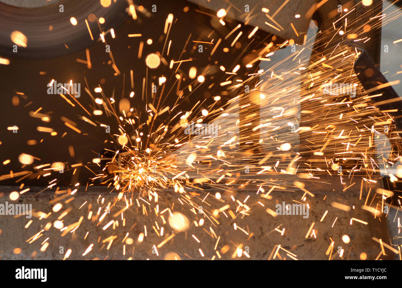 Spark stream of cutter machine cutting iron pipe, spark light ...