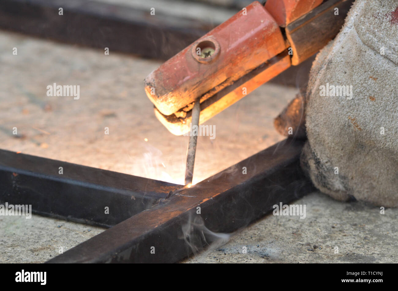 Spark from weld work when welder welding iron, steel structure in ...
