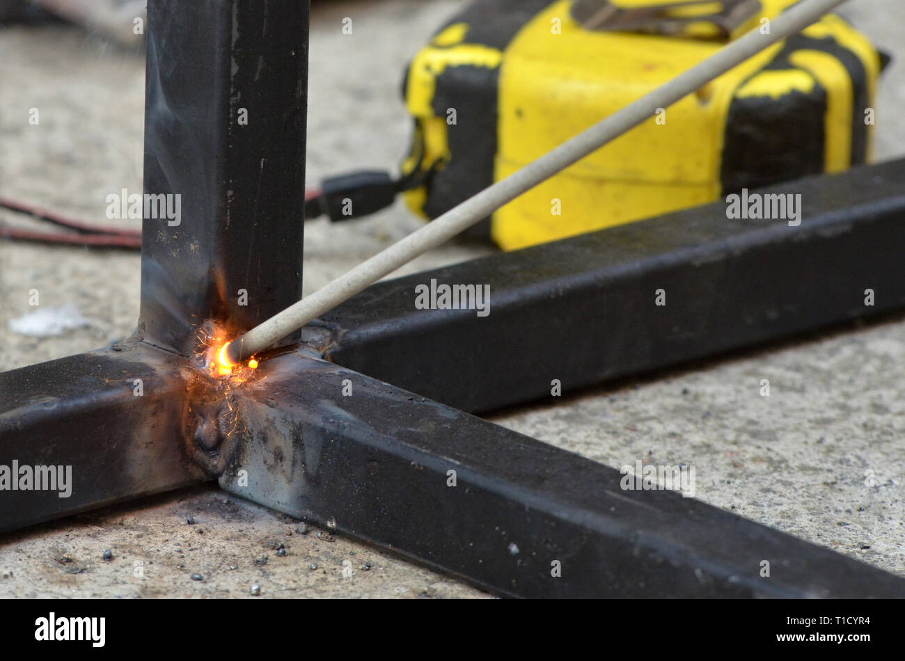Spark from weld work when welder welding iron, steel structure in construction site, industrial ...