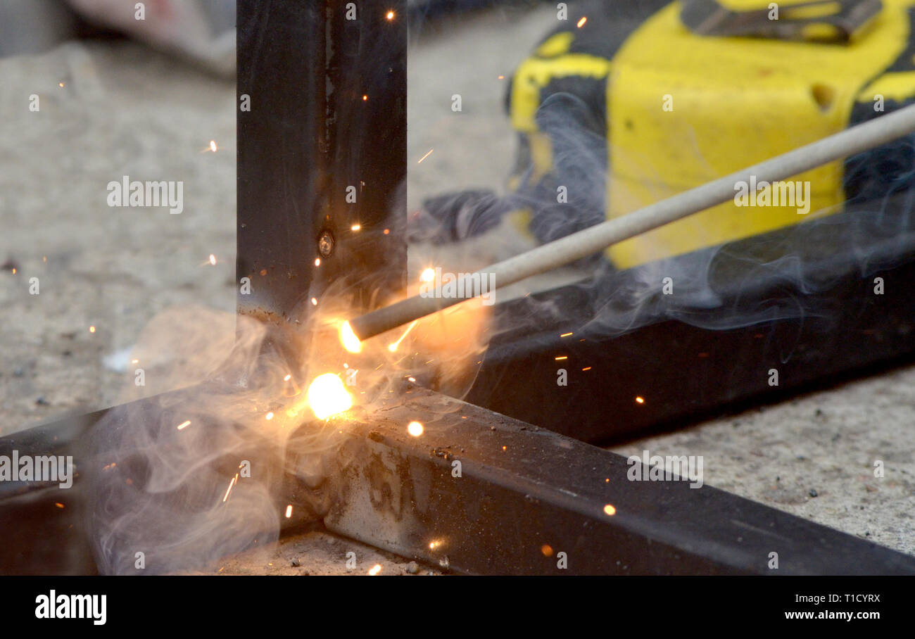 Spark from weld work when welder welding iron, steel structure in ...