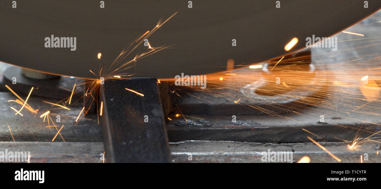 Spark stream of cutter machine cutting iron pipe, spark light ...